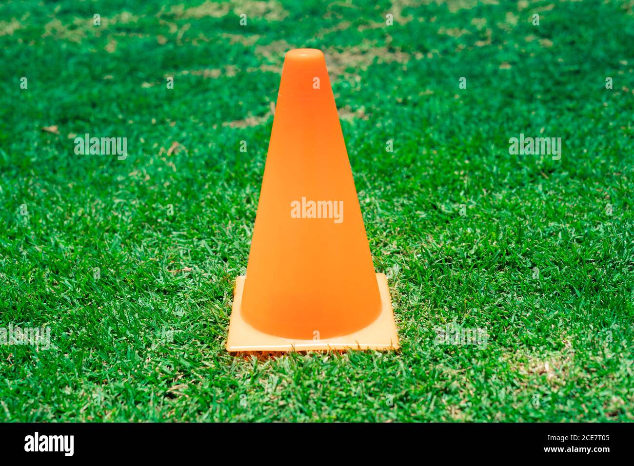 Closeup shot of a football training cone in a field lawn Stock Photo ...