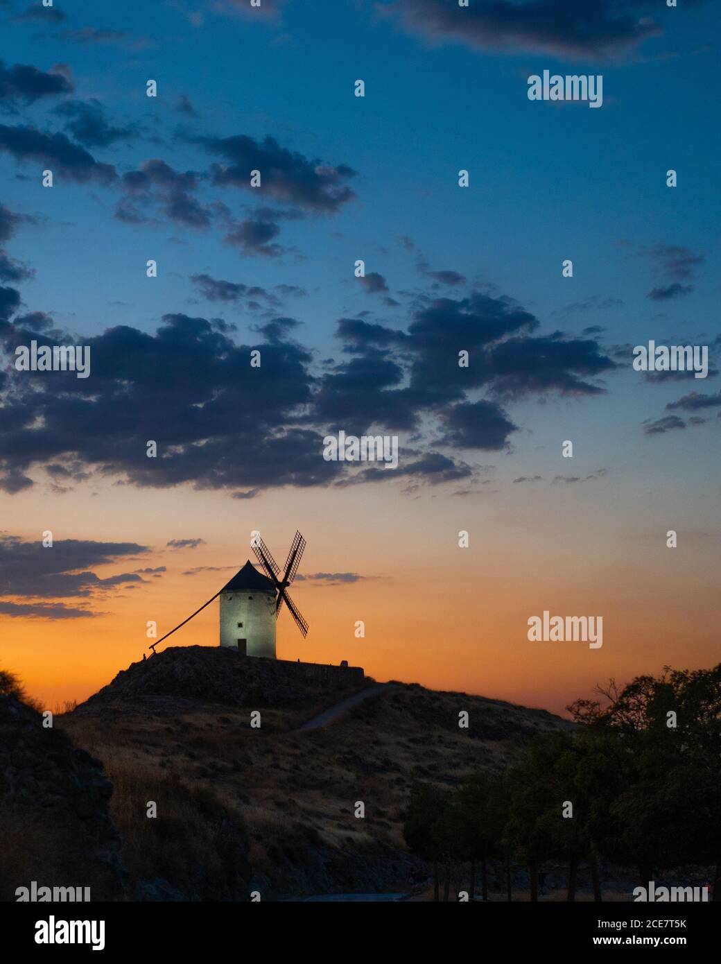 Amazing shot of a windmill on an orange sunset background Stock Photo ...