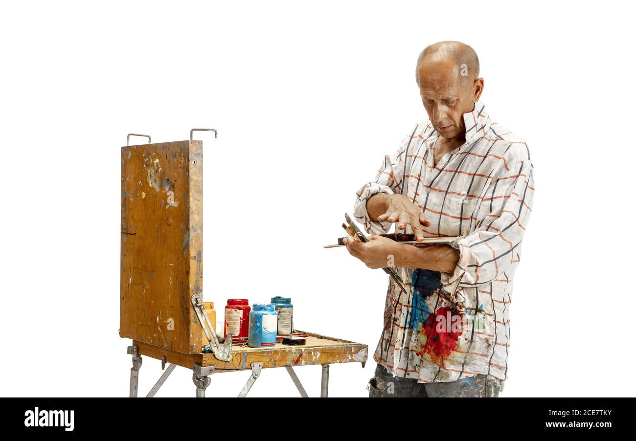 Male caucasian artist, painter at work isolated on white studio ...
