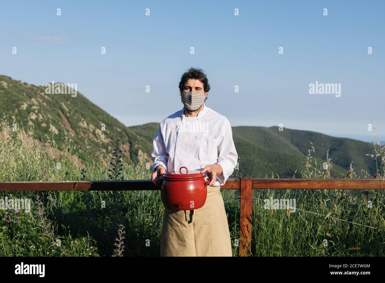 Man anonymous mask standing against hi-res stock photography and images ...