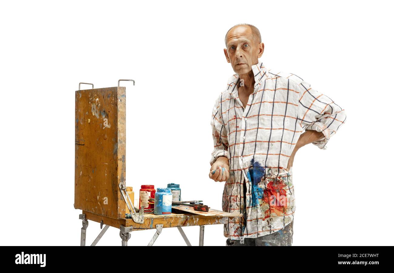Male caucasian artist, painter at work isolated on white studio ...