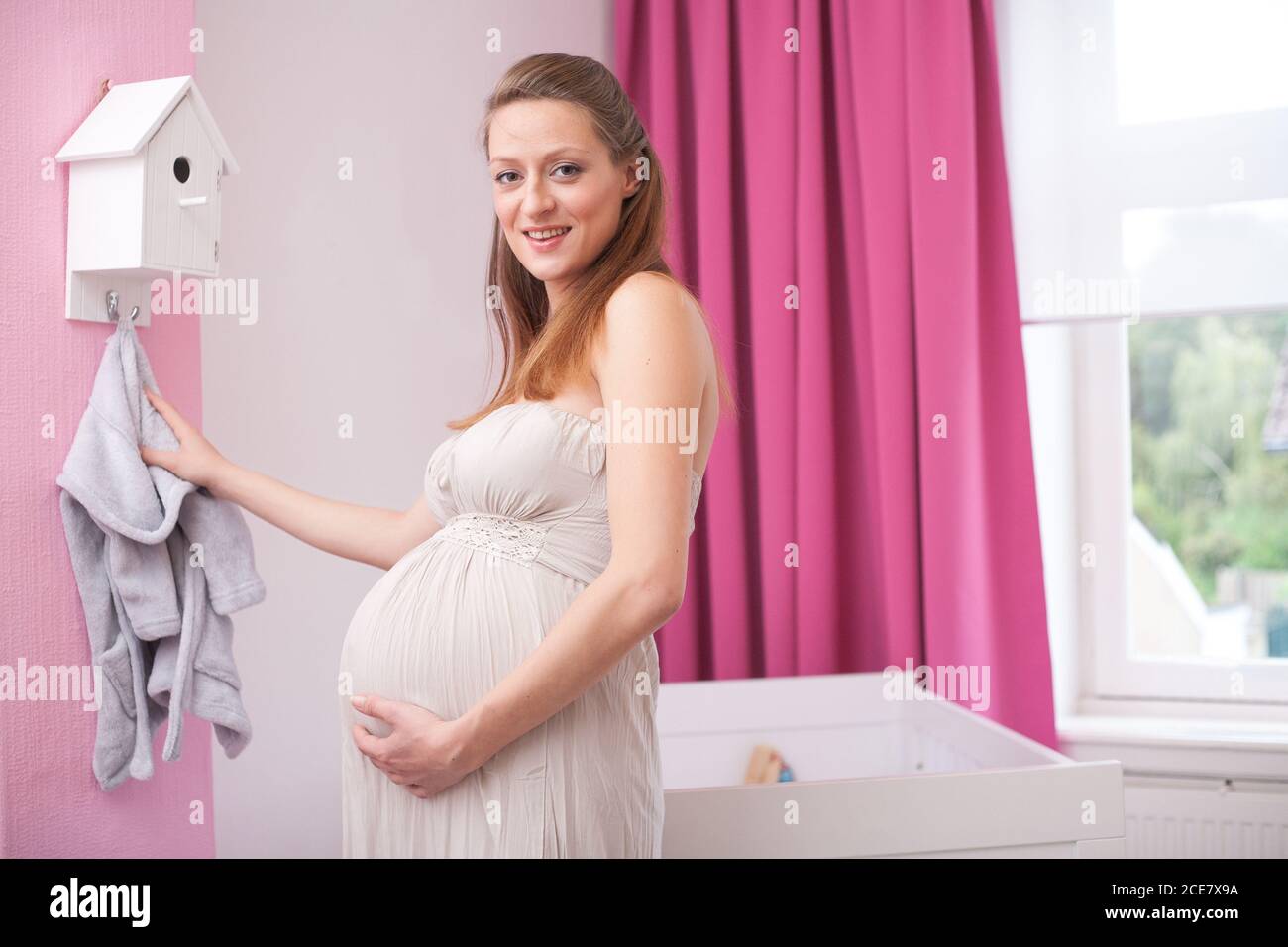 Hanging belly girl hi-res stock photography and images - Alamy