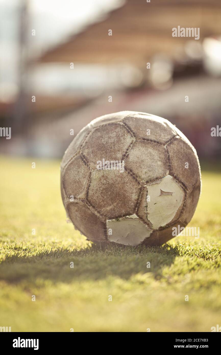 From above of used leather football ball with hexagon pattern and ...