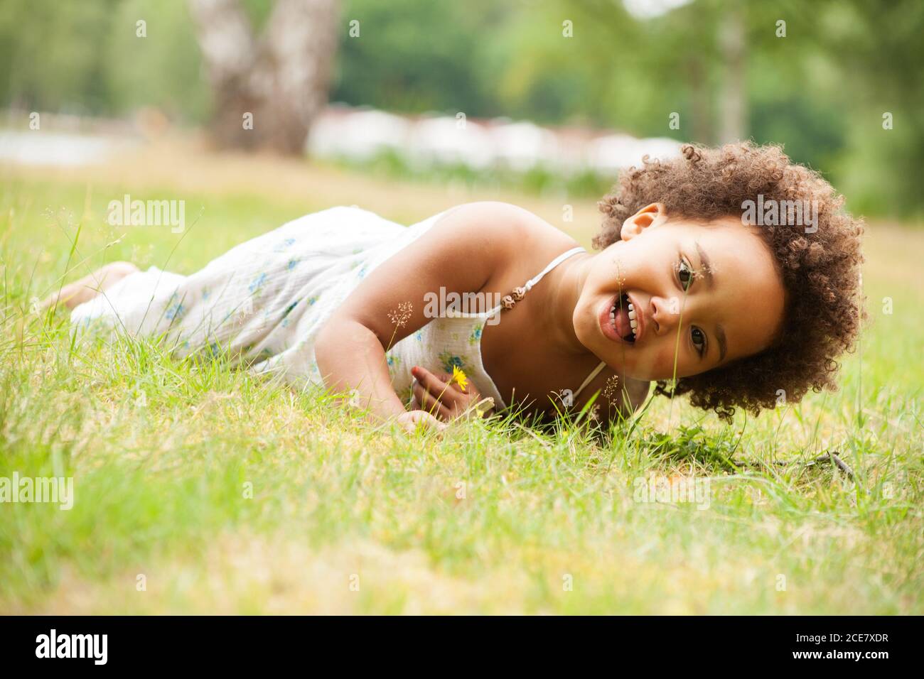 African girl is laying down Stock Photo - Alamy