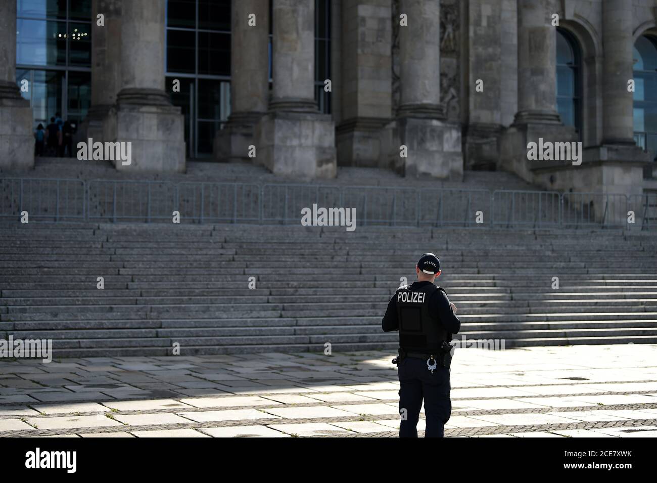 Berlin, Germany. 31st Aug, 2020. A policeman stands in front of the ...