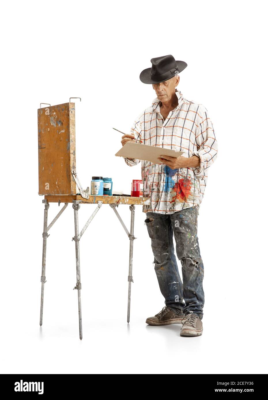 Male caucasian artist, painter at work isolated on white studio ...