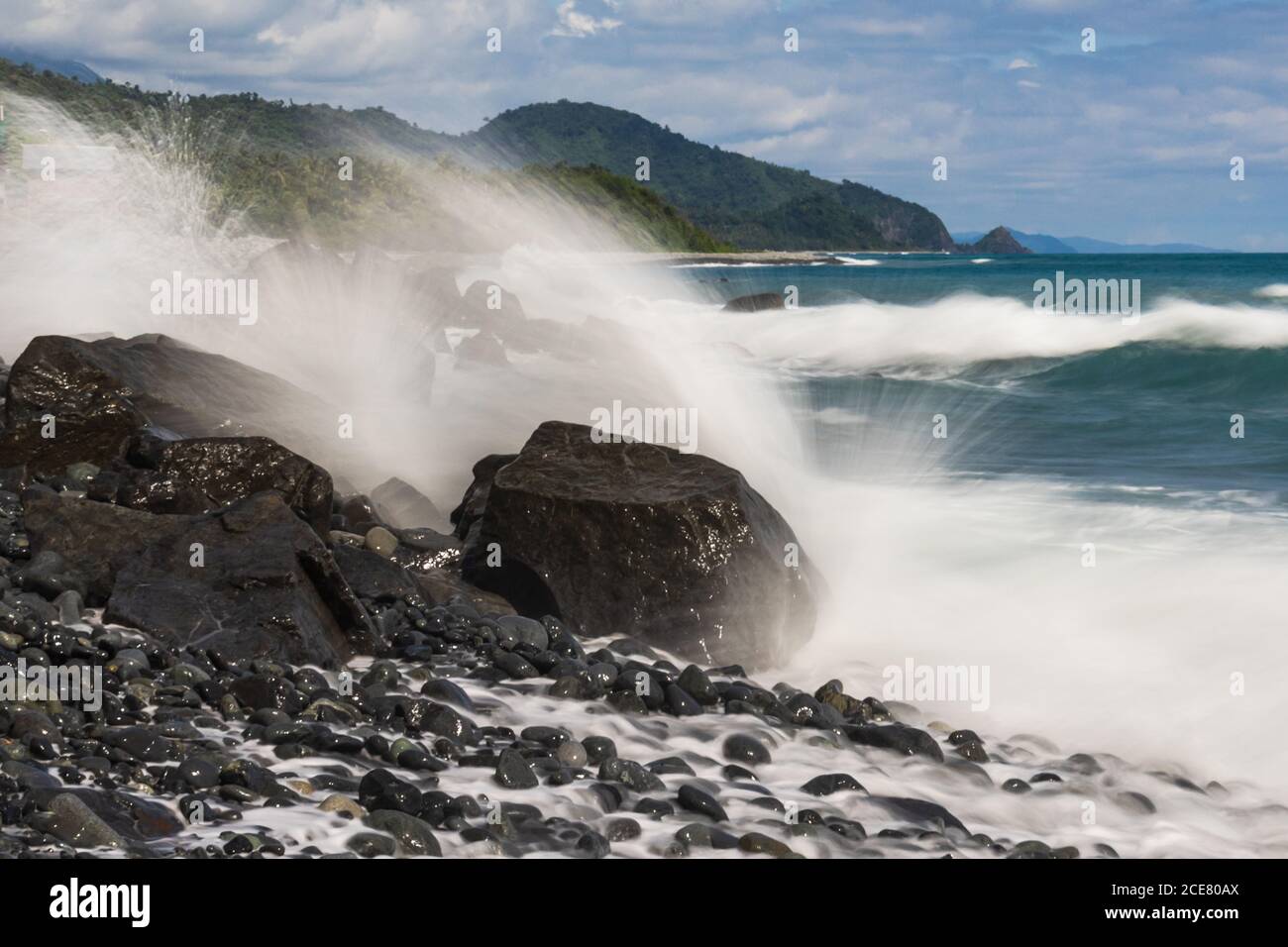Waves Hitting Big Rocks Stock Photo - Alamy