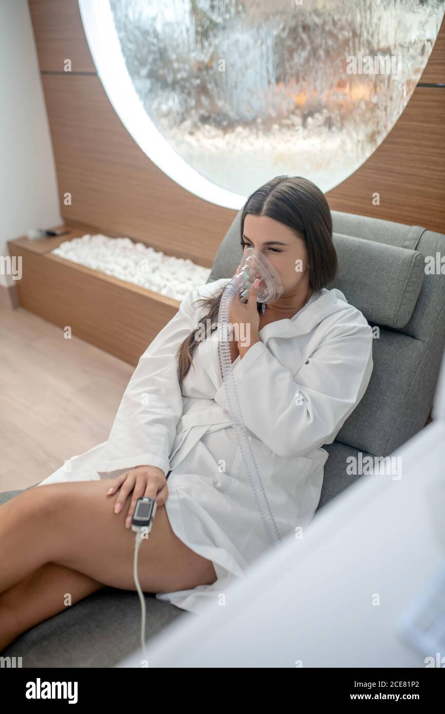 Woman doing oxygen mask procedure in a rehabilitation center Stock ...
