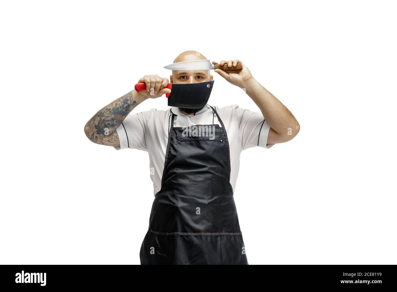Portrait of a male chef cook, butcher isolated on a white studio ...