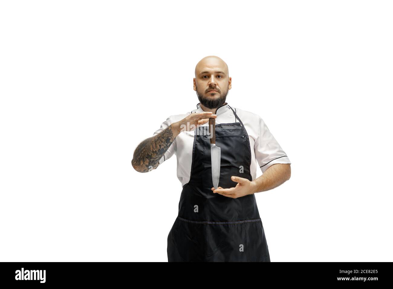 Portrait of a male chef cook, butcher isolated on a white studio ...