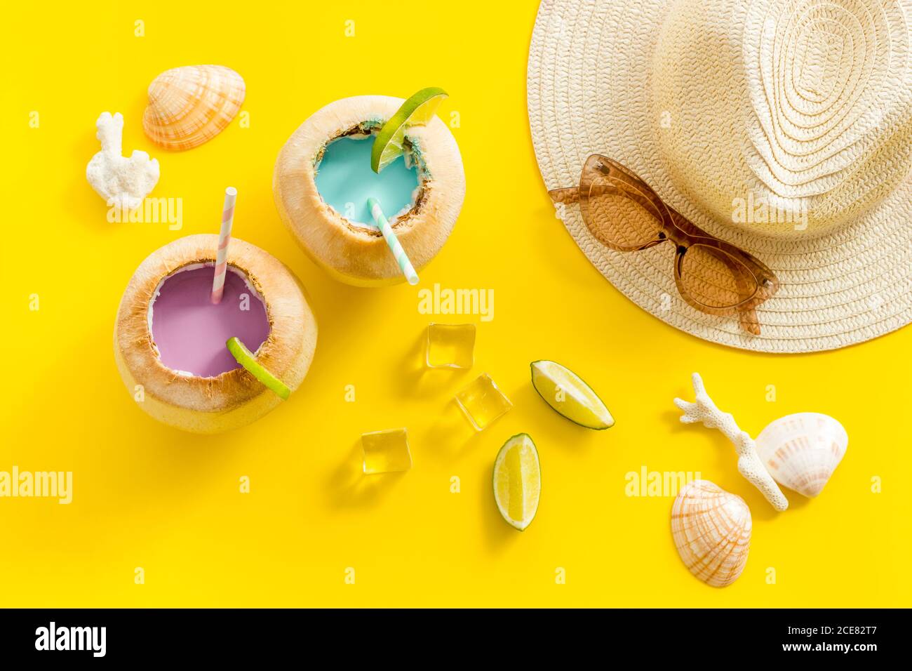 Young coconut water with straw on beach background, top view Stock ...