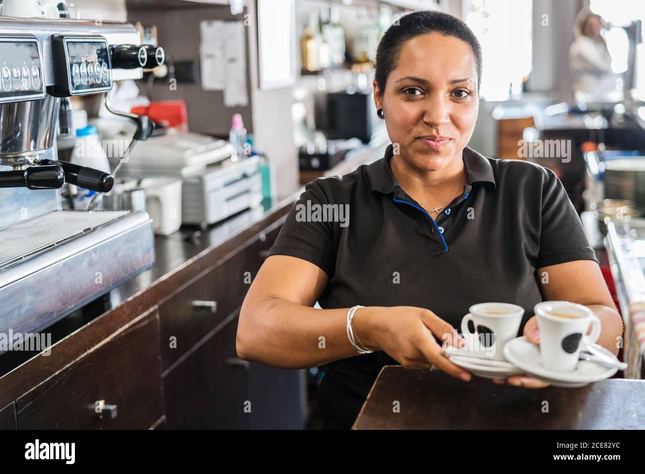 Black female shop worker hi-res stock photography and images - Alamy