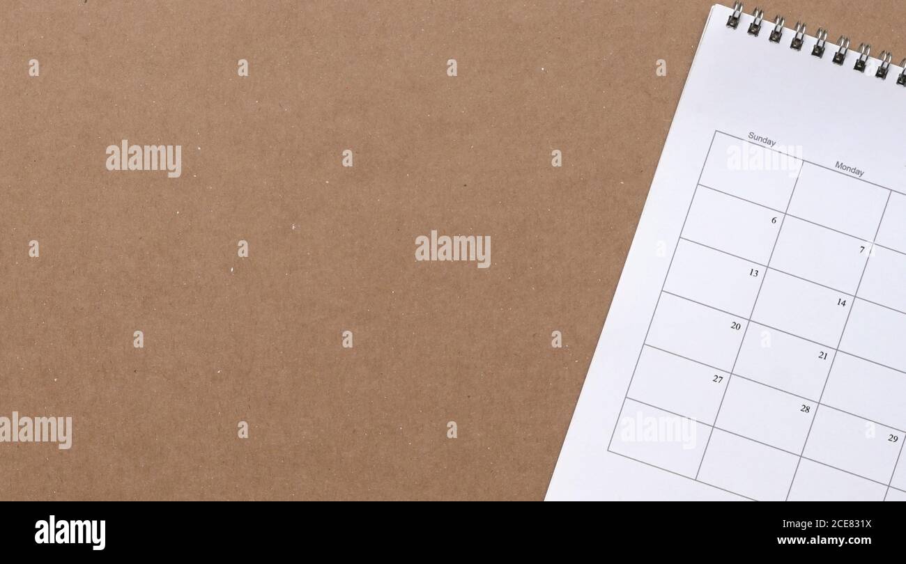 Calendar on brown cardboard paper, copy space. Business meeting ...