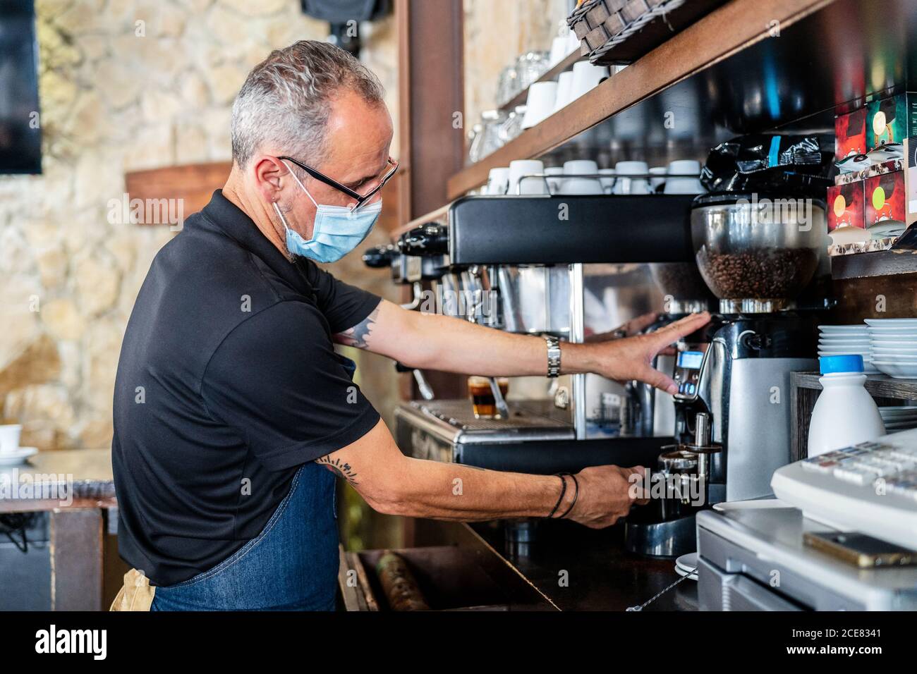 Concentrated male barista in hi-res stock photography and images - Alamy