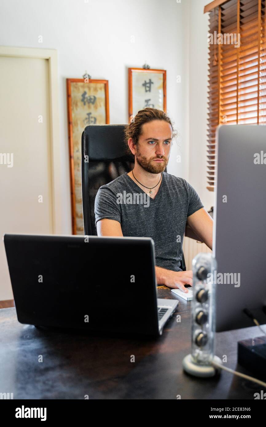 Man working on computer hi-res stock photography and images - Alamy