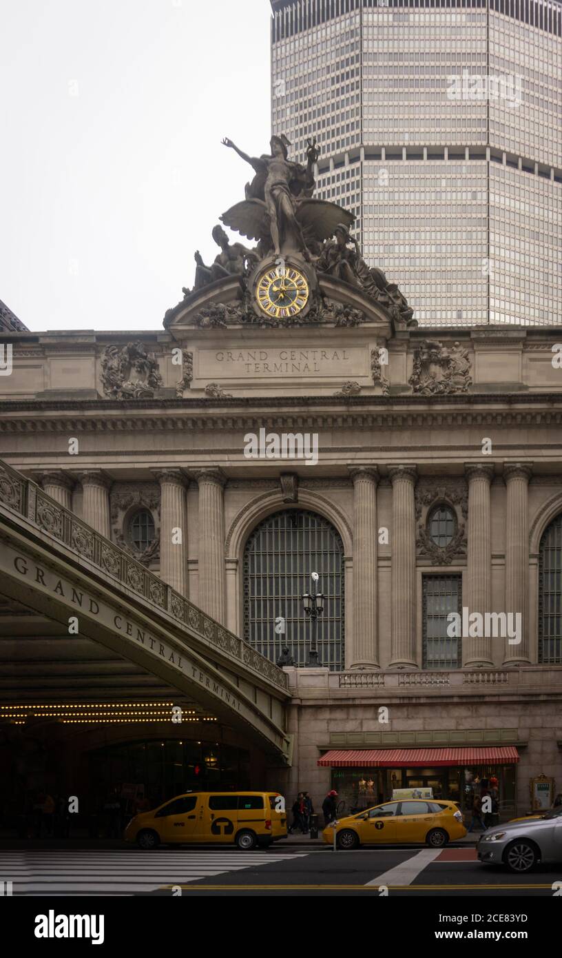 Exterior of aged stone building of Grand Central Terminal with clocks ...