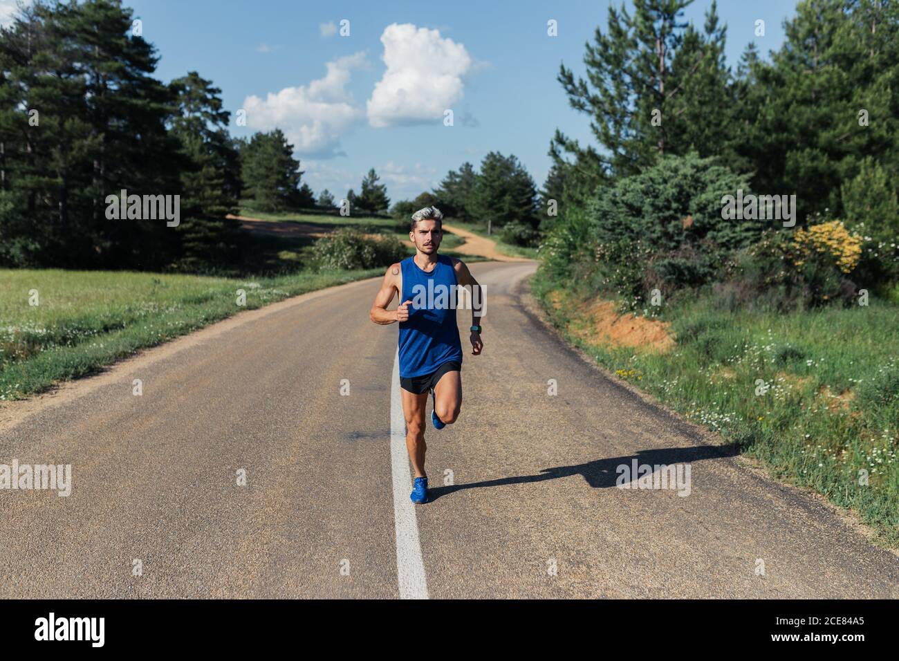 Full length of man running on road hi-res stock photography and images ...