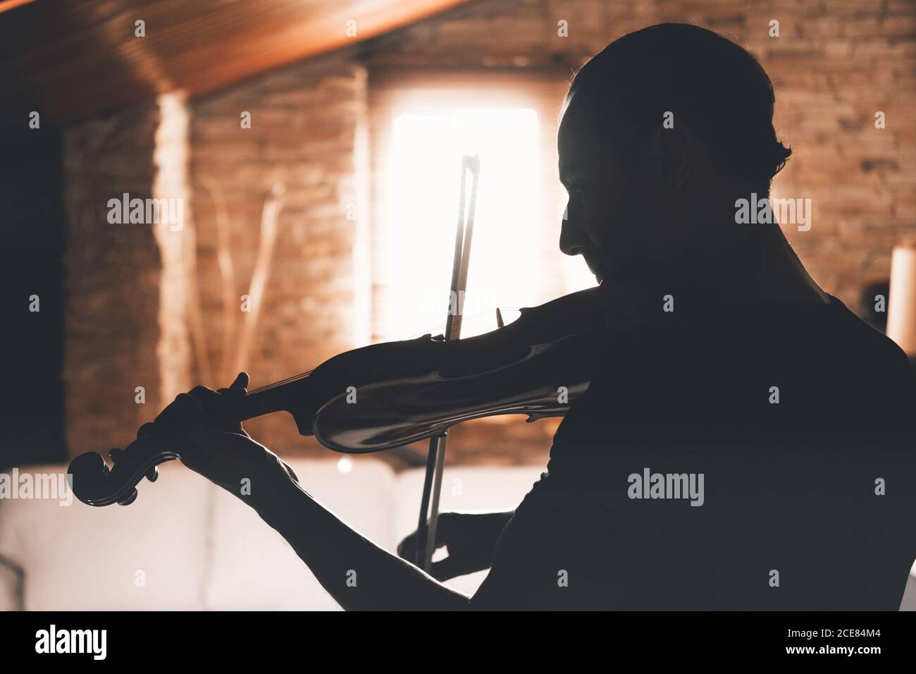 Silhouette man professional violinist playing hi-res stock photography ...
