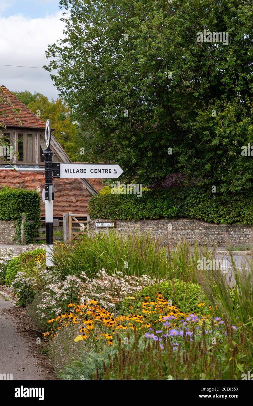 A sign post in an English village pointing to the village centre Stock ...