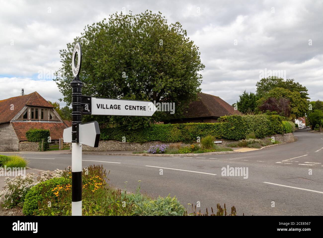 A sign post in an English village pointing to the village centre Stock ...