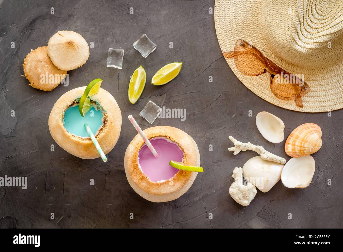 Young coconut water with straw on beach background, top view Stock ...