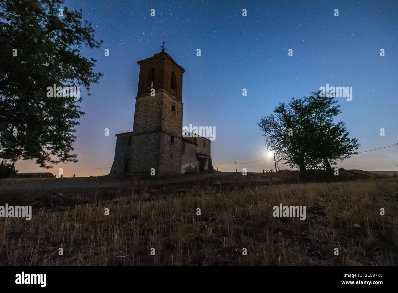 Low view of bell tower on the hill under spectacular scenery with ...
