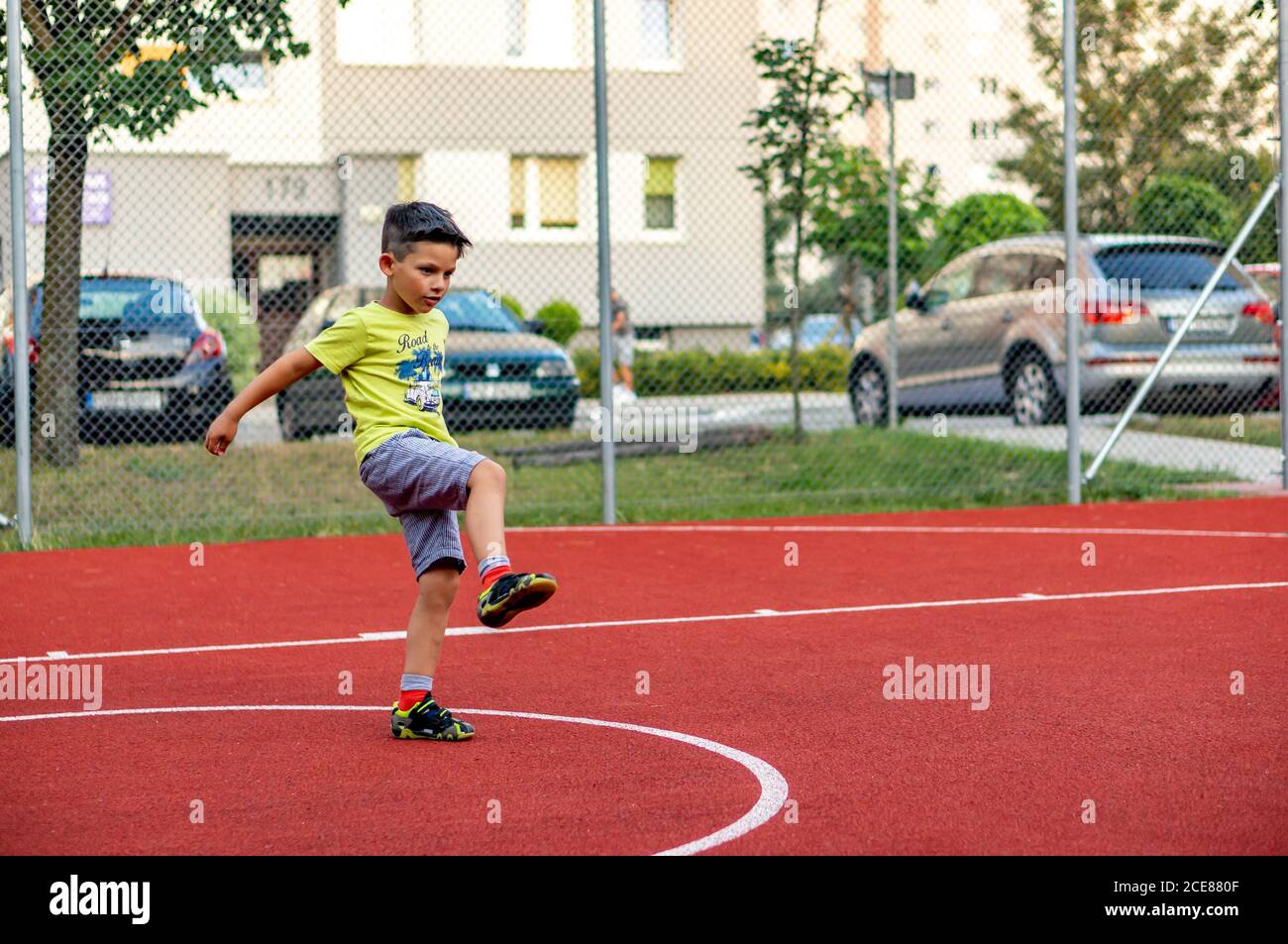 POZNAN, POLAND - Aug 26, 2020: Young Polish Caucasian boy kicking on a ...