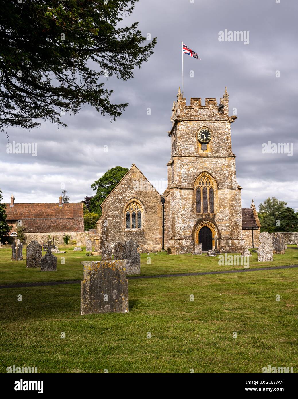 A union jack flag flies from the traditional gothic tower of Chetnole ...