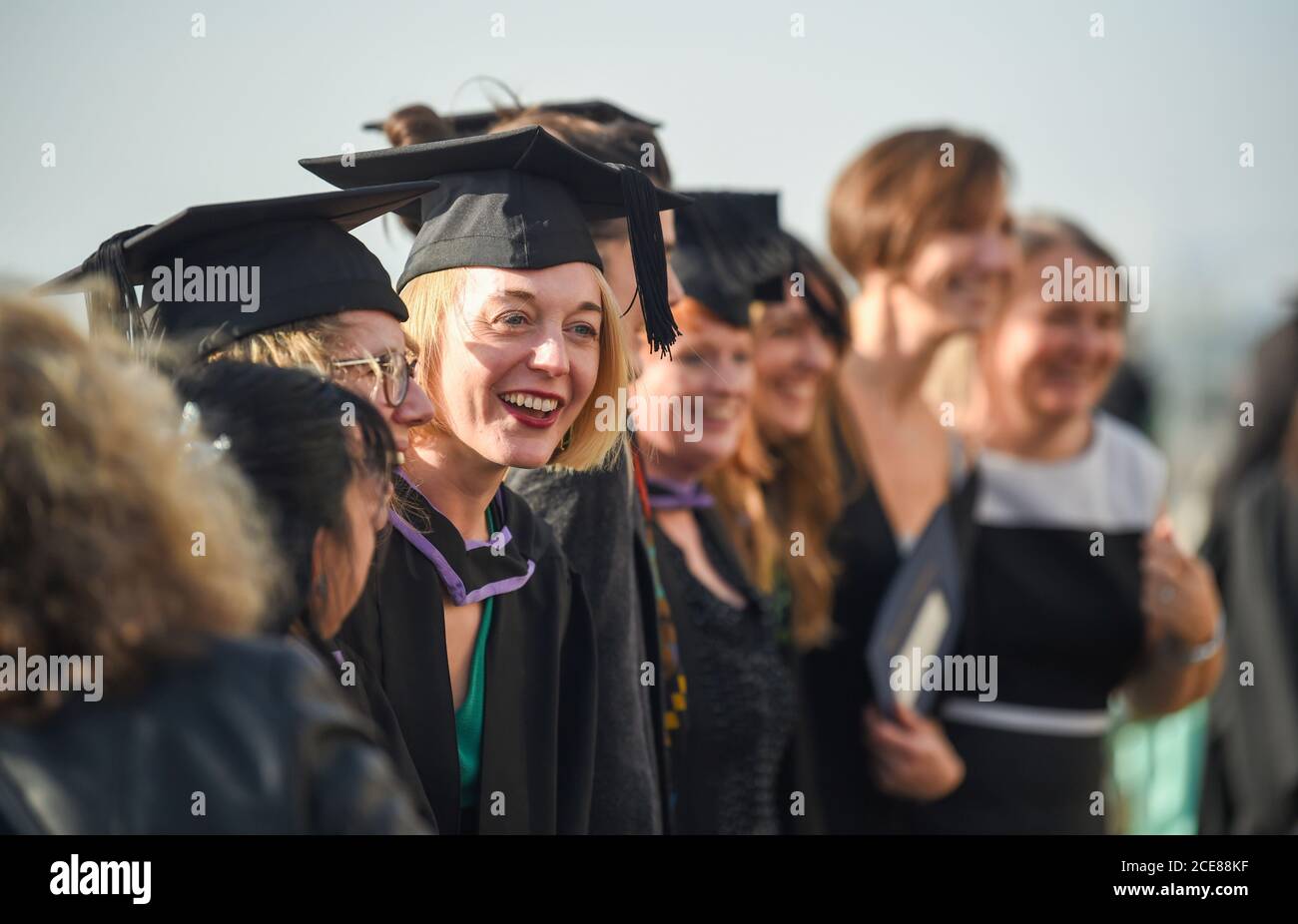 Education smiling celebrating students hi-res stock photography and ...