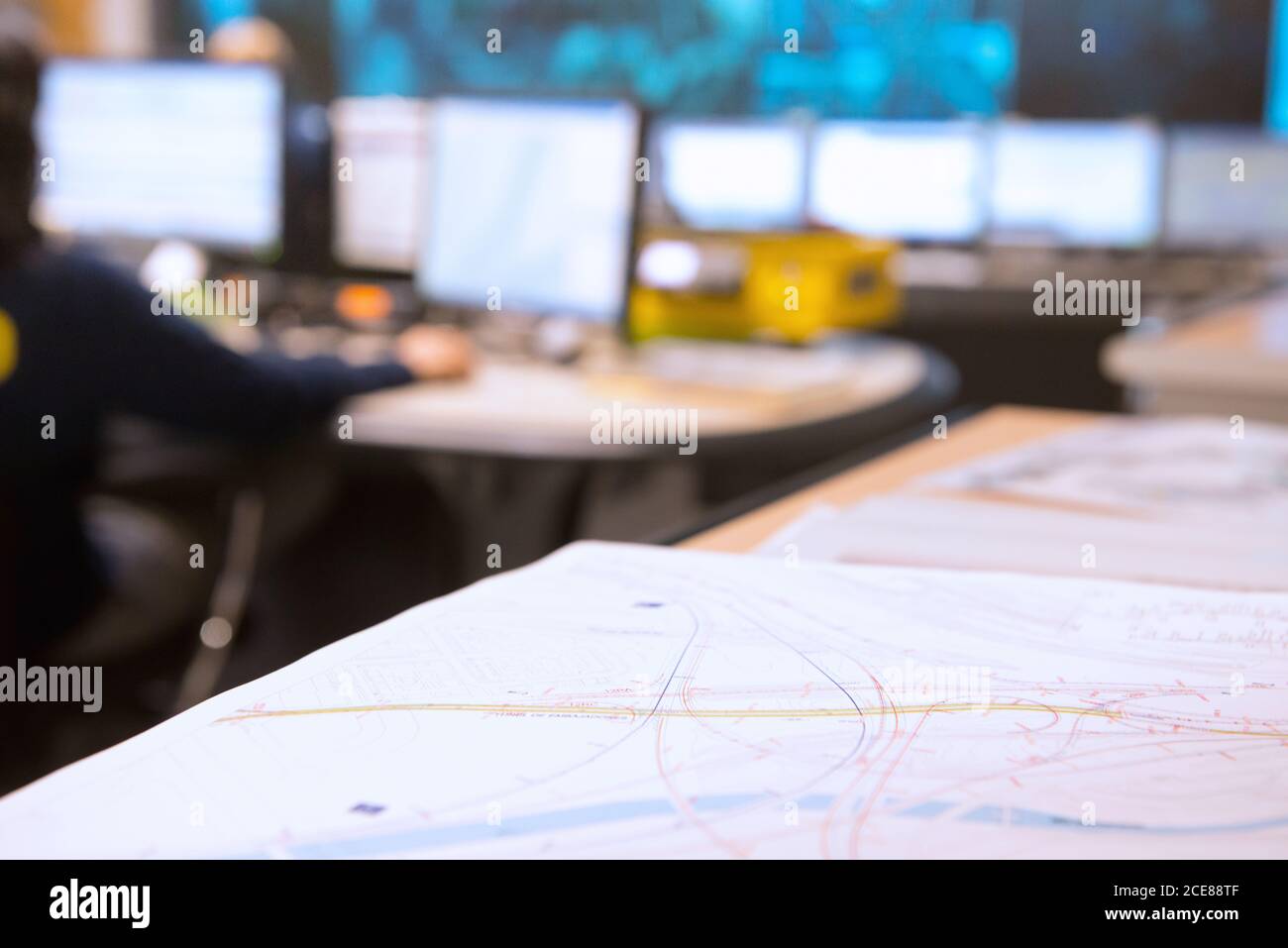 Back view of crop anonymous employee working on computer in office on ...