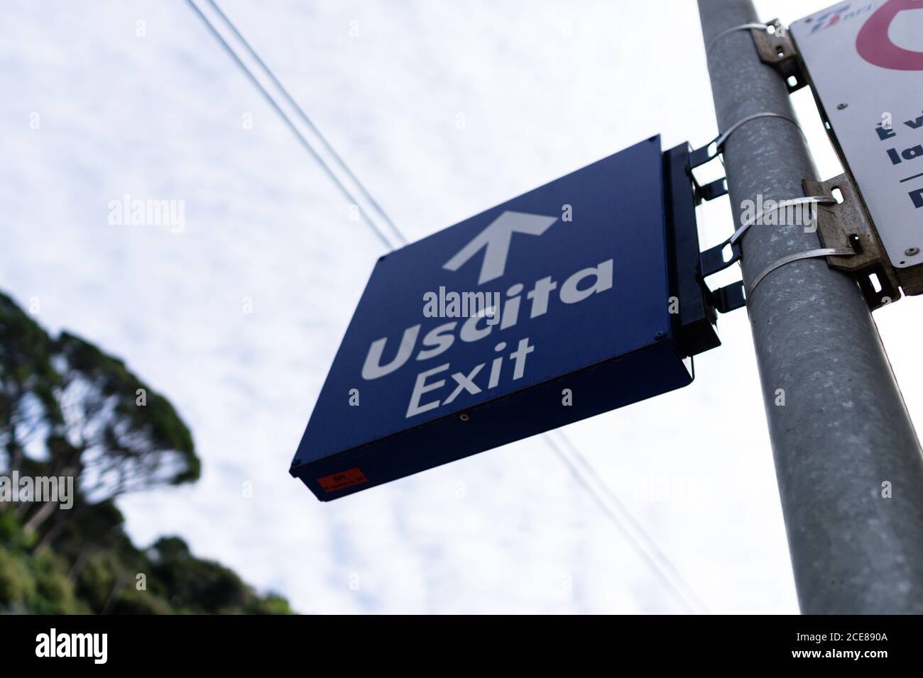 Low angle shot of a street sign on a metal poll reading "Exit" in ...