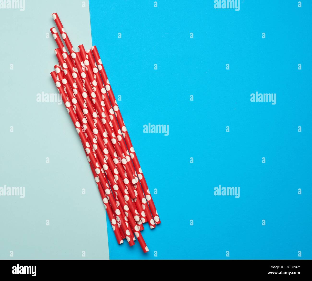 paper red cocktail tubes on a blue background, rejection of plastic ...