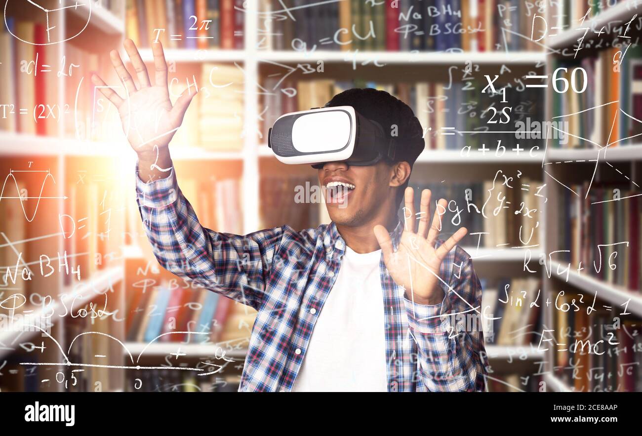 Black Student In VR Headset Standing In Library Indoors, Collage Stock ...