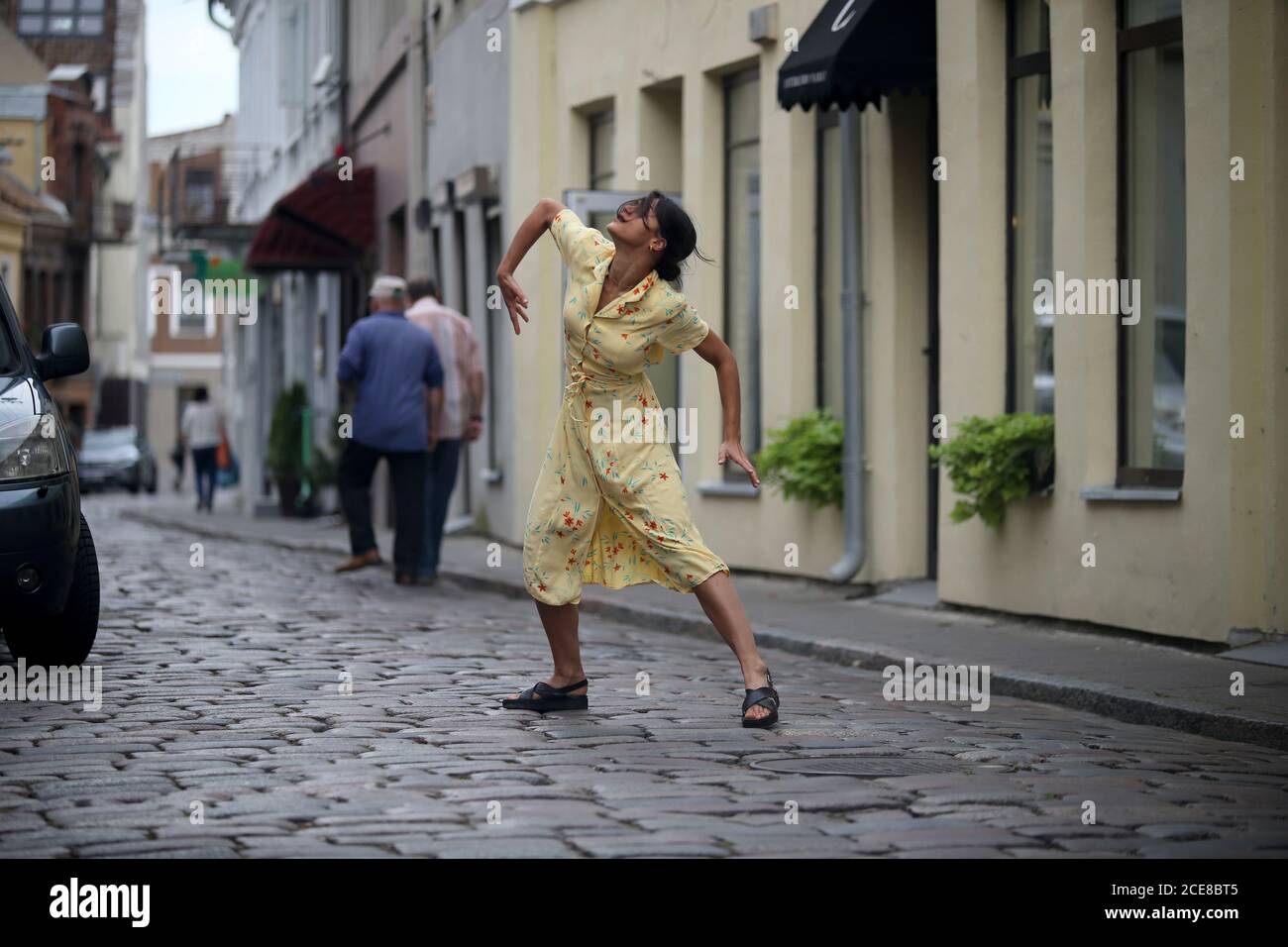 Solo dancer. A beautiful attractive woman jumping one dance down the ...