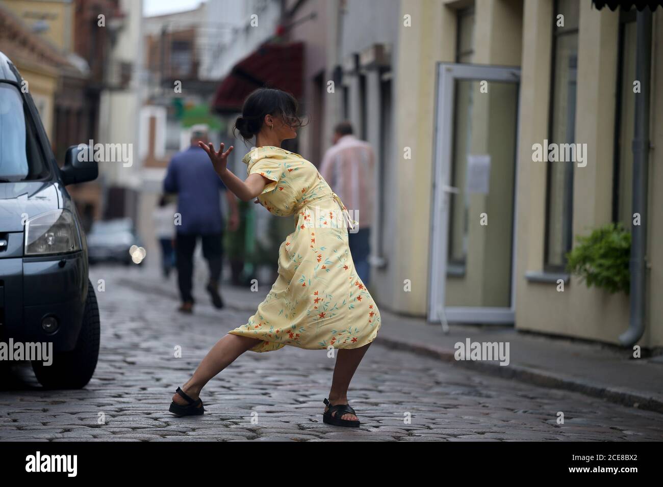 Solo dancer. A beautiful attractive woman jumping one dance down the ...