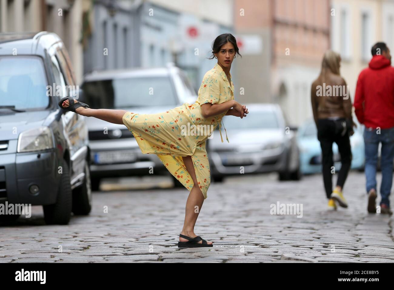 Solo dancer. A beautiful attractive woman jumping one dance down the ...