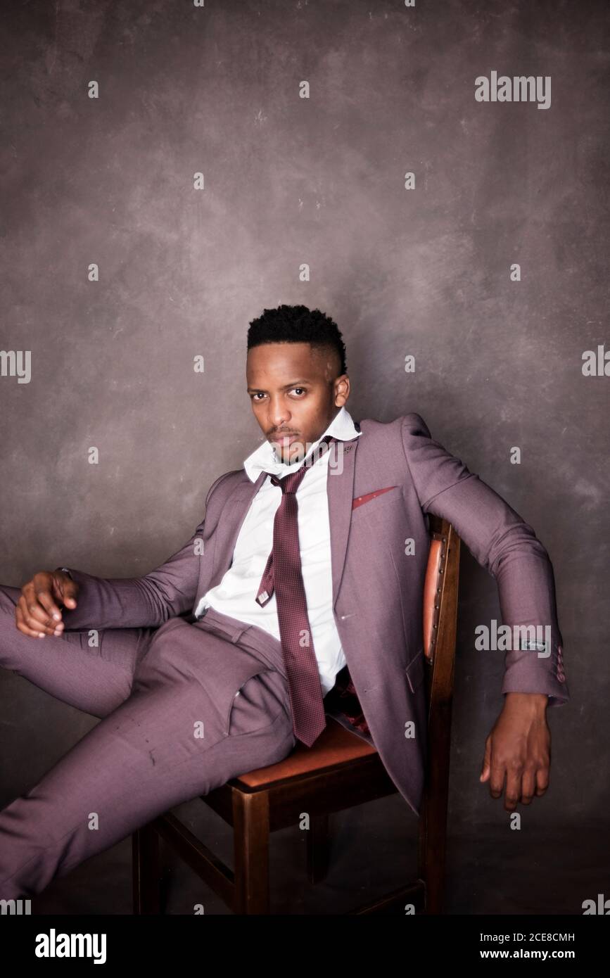 african stock photo of black gentlemen in smart clothes in studio ...