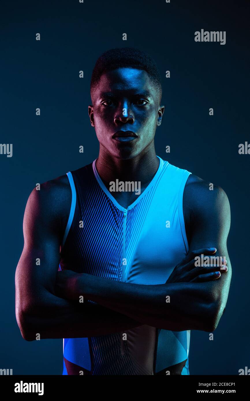 Serious concentrated young African American male athlete standing ...