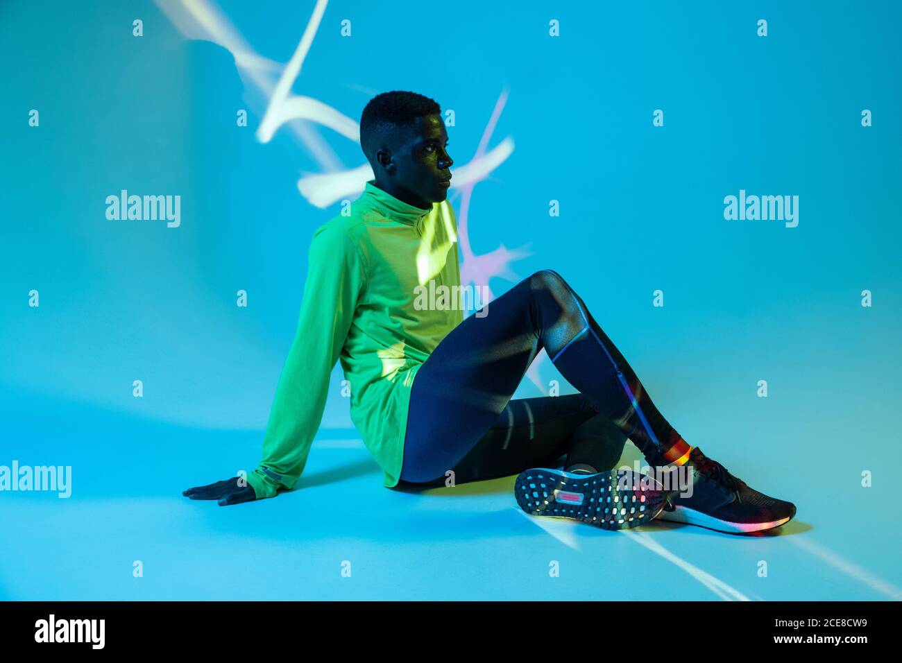 Full body side view of strong young African American male athlete in ...