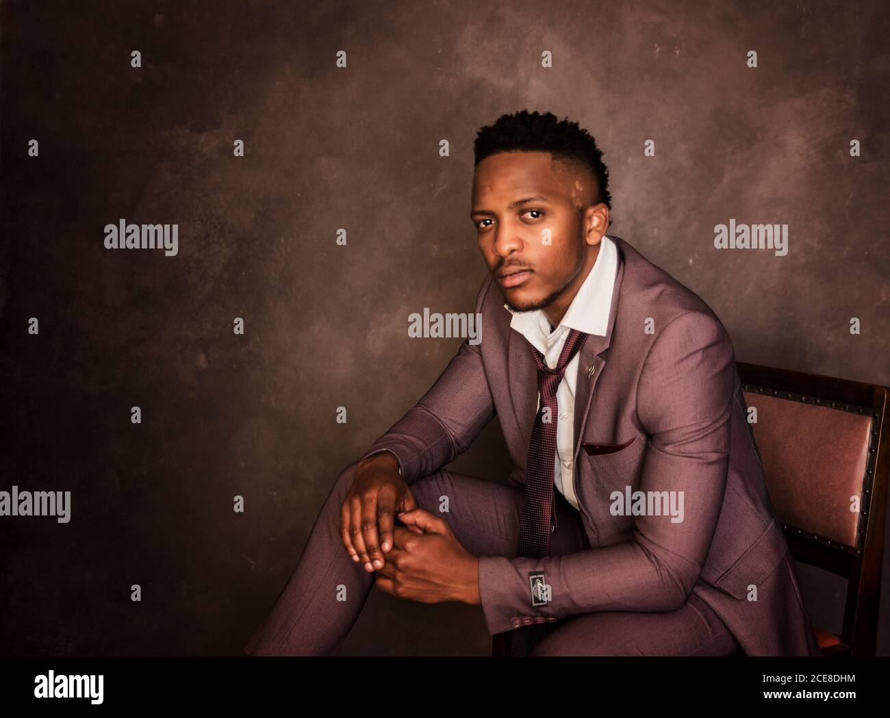 african stock photo of black gentlemen in smart clothes in studio ...