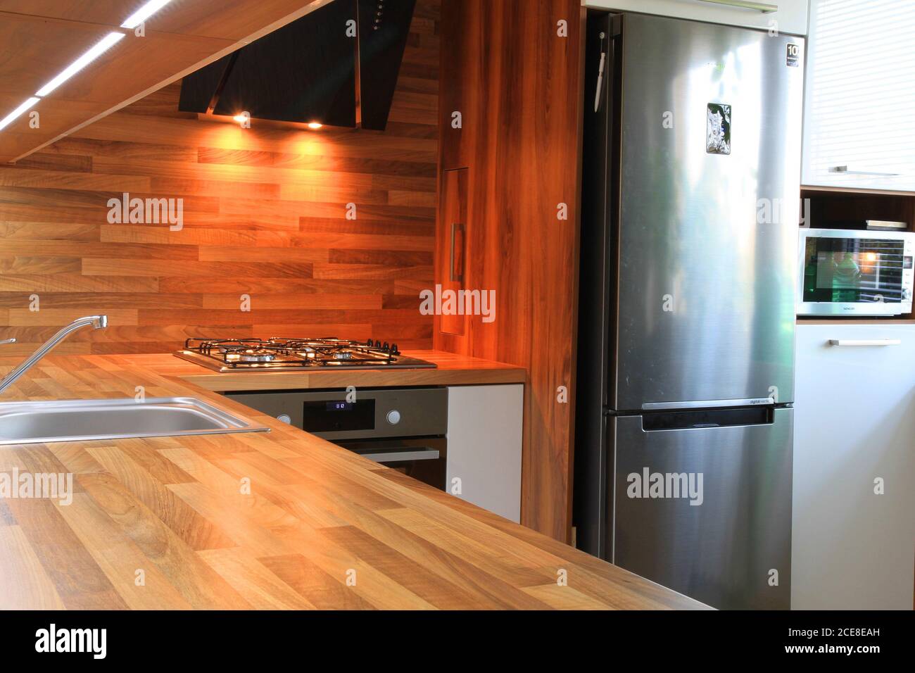 modern kitchen interior (white color and wooden texture Stock Photo - Alamy