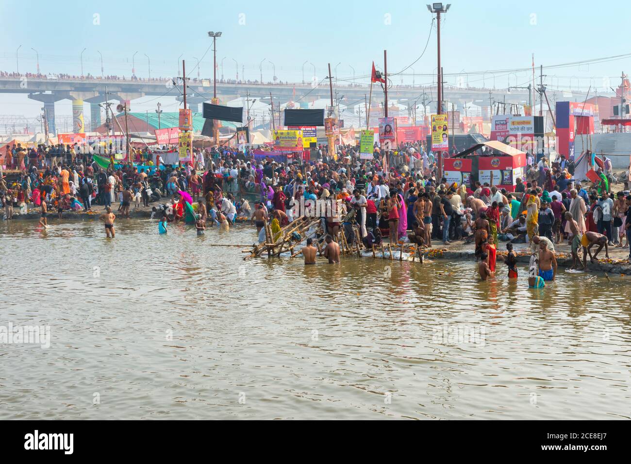 Pilgrims waiting to enter the Ganges river for the ritual bathing ...