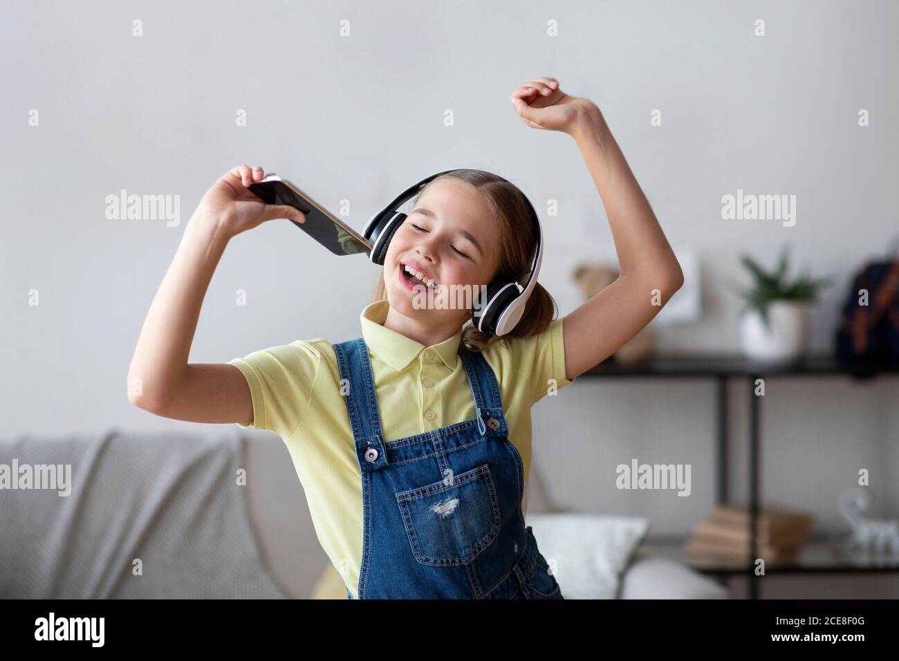 Child teen girl singing microphone hi-res stock photography and images ...