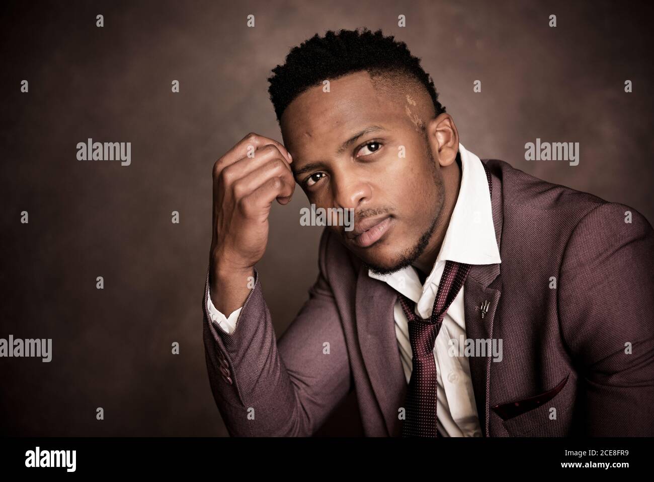 african stock photo of black gentlemen in smart clothes in studio ...