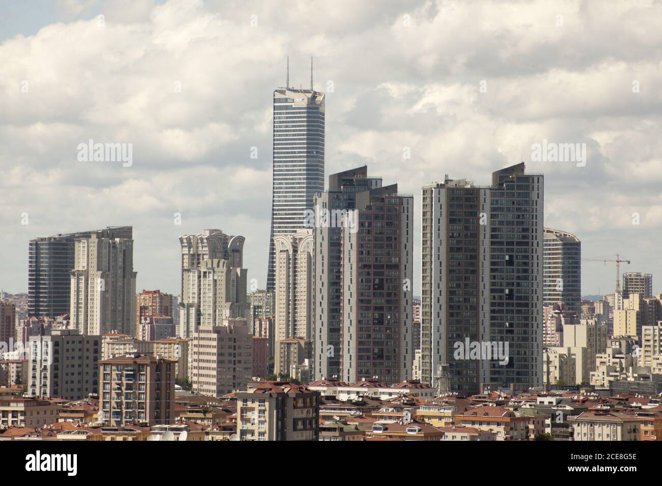 Beautiful cityscape view with high-rise buildings under a cloudy sky ...