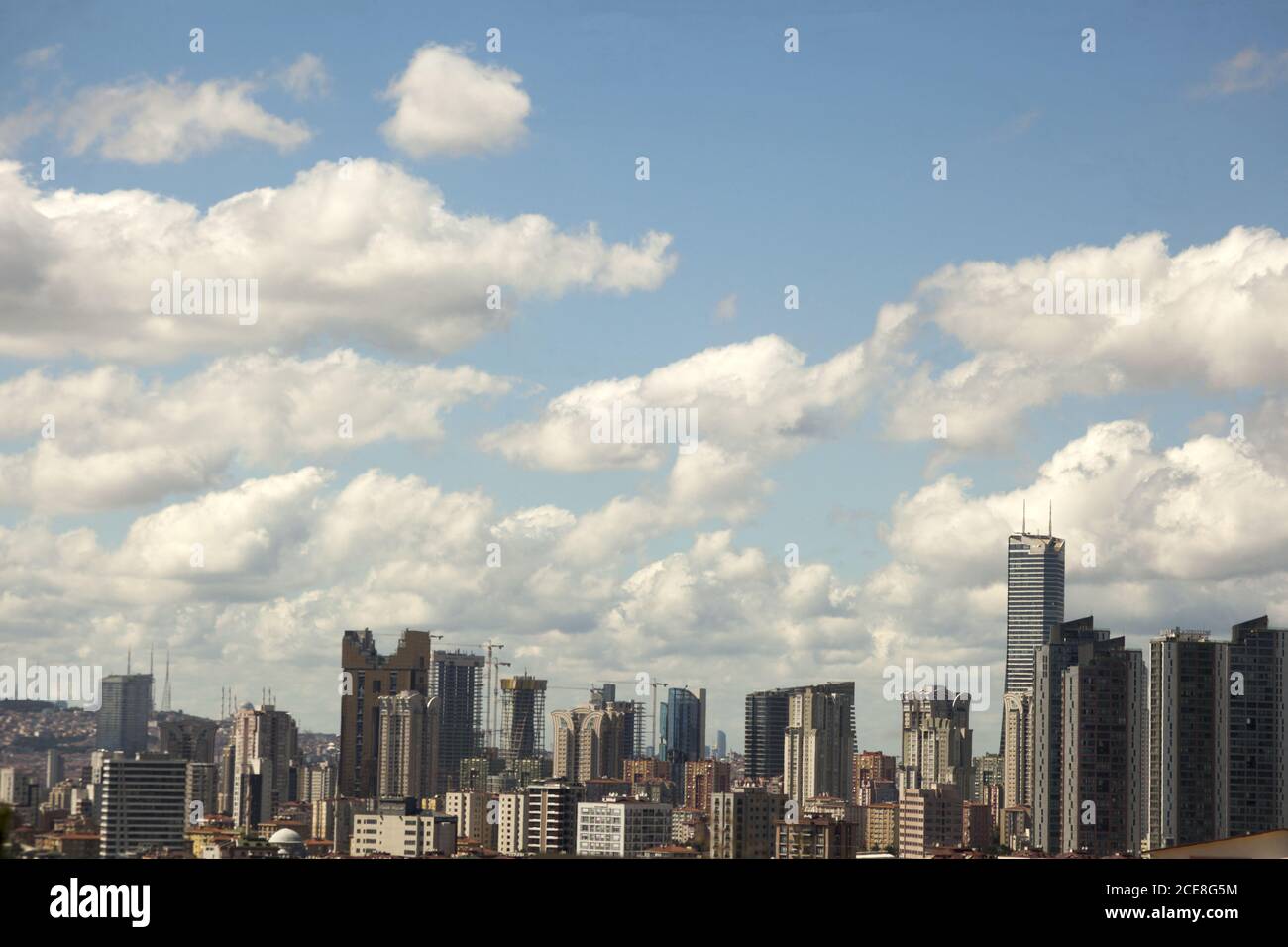 Beautiful cityscape view with high-rise buildings under a cloudy sky ...