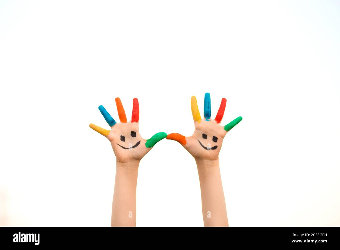 Children hand in colorful paint with smile isolated on white background ...