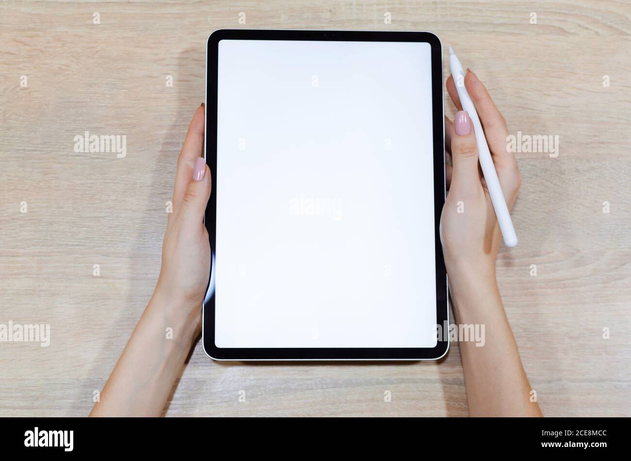 Girl using stylus on tablet to draw her ideas Stock Photo - Alamy