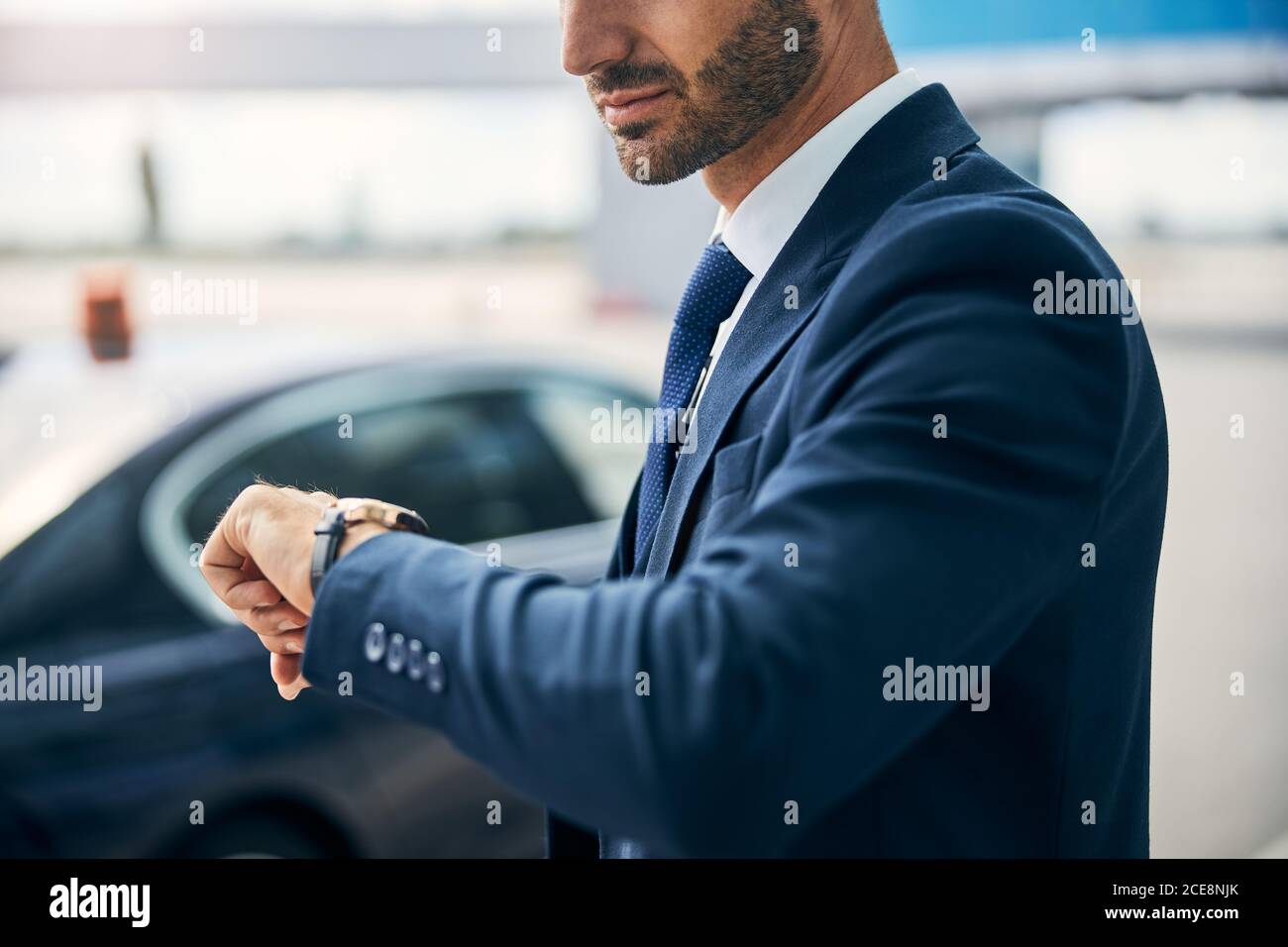 Man checking watch car hi-res stock photography and images - Alamy