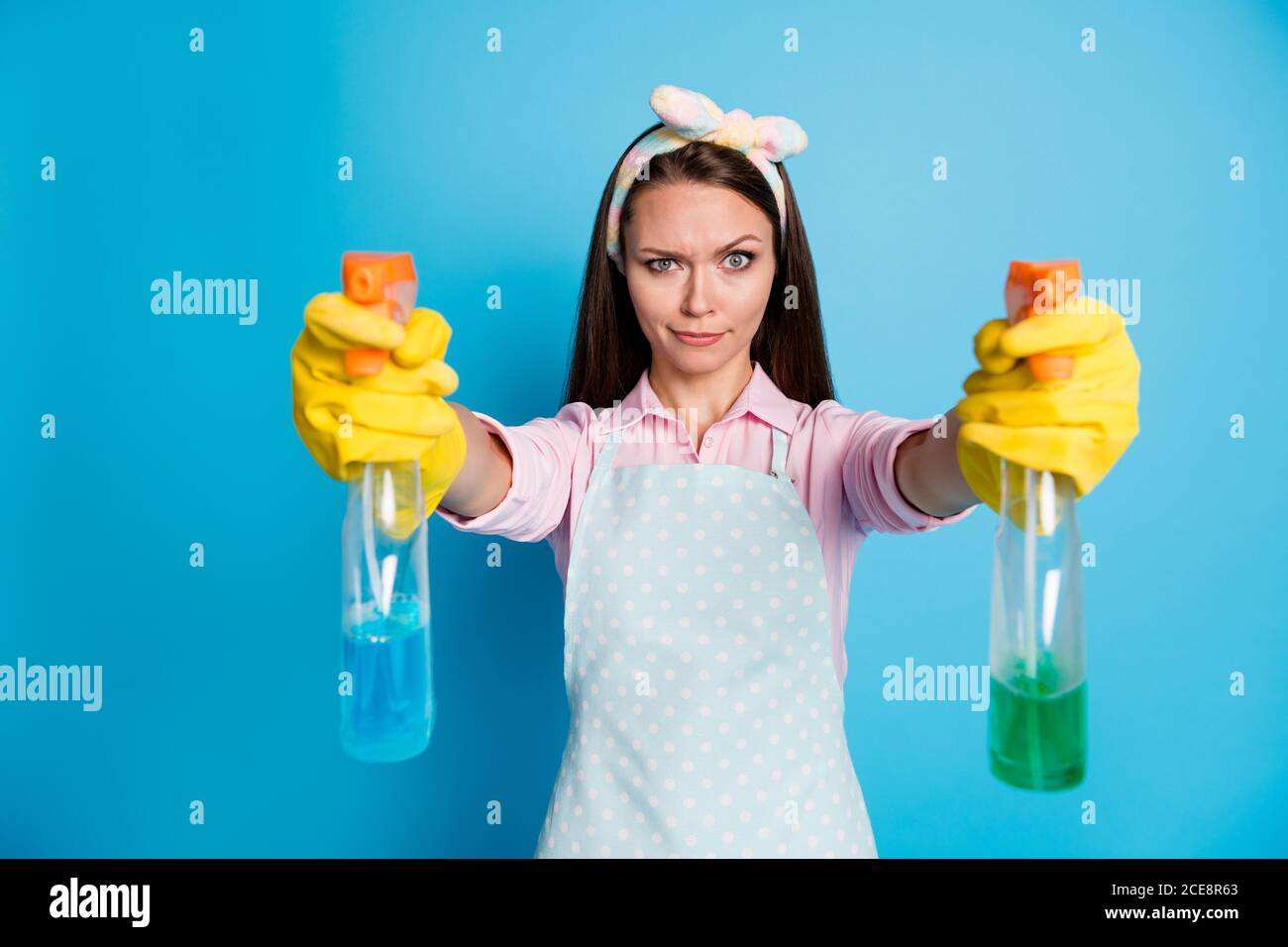 Portrait of focused girl cleaner want disinfect house home hold spray ...